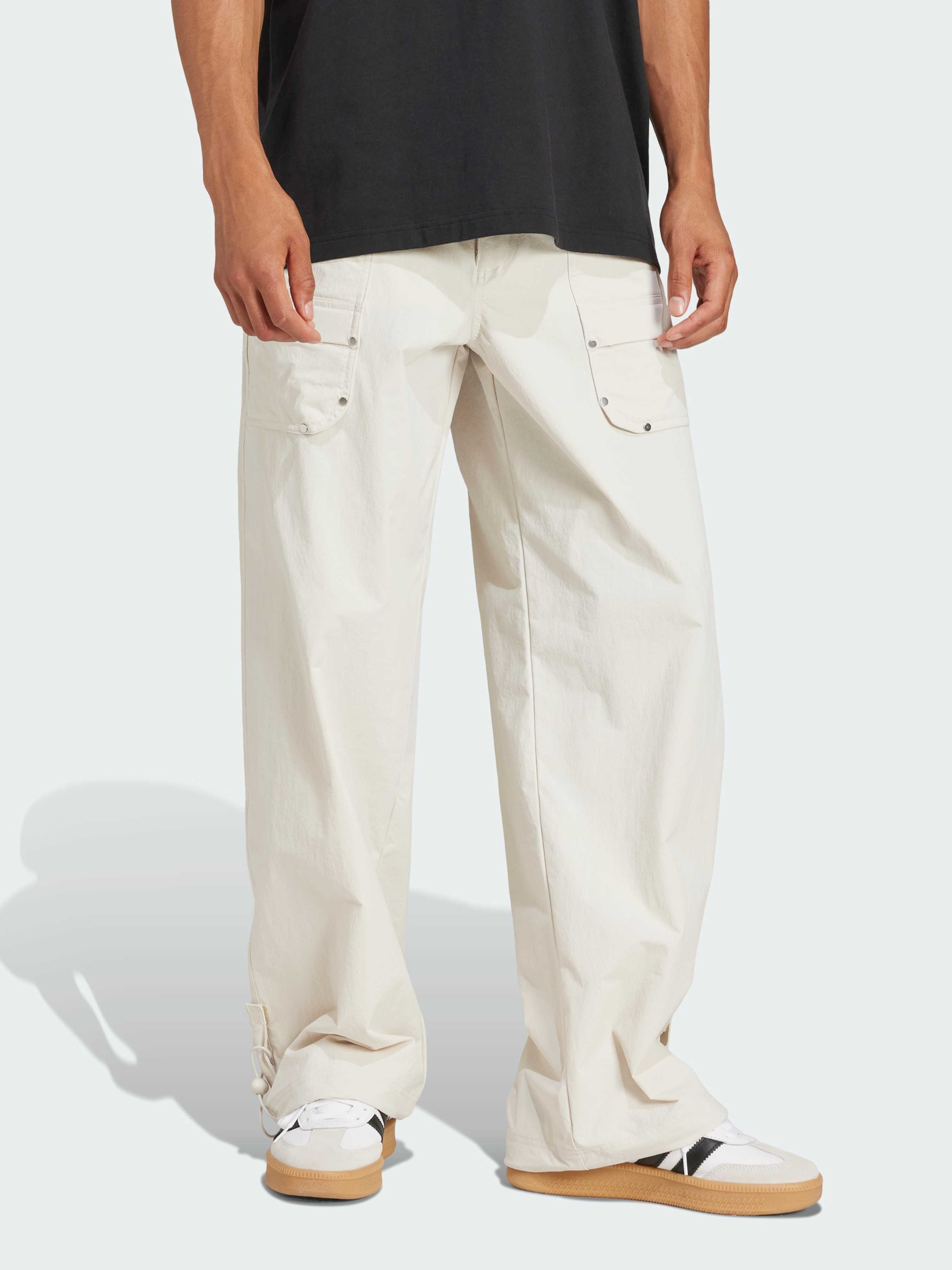 Штани повсякденні adidas JD5763 для чоловіків, колір: Бежевий - купити ...